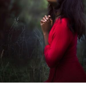 praying woman in red psalm 3 - Seeking God with Joy | Christian Blog